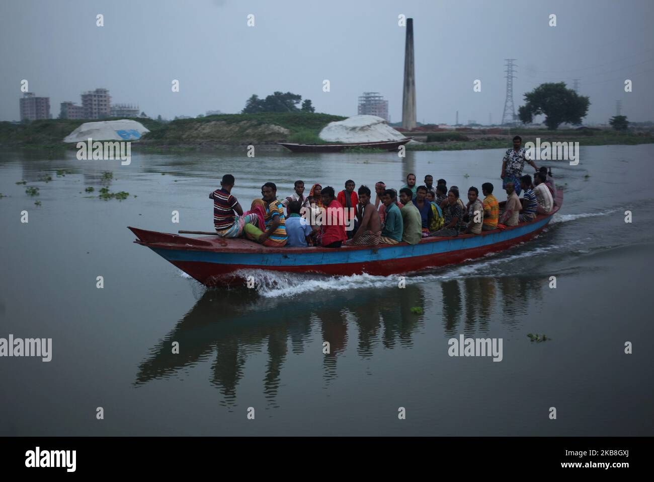 People seen crossing The Turag river through boat in Dhaka, Bangladesh ...