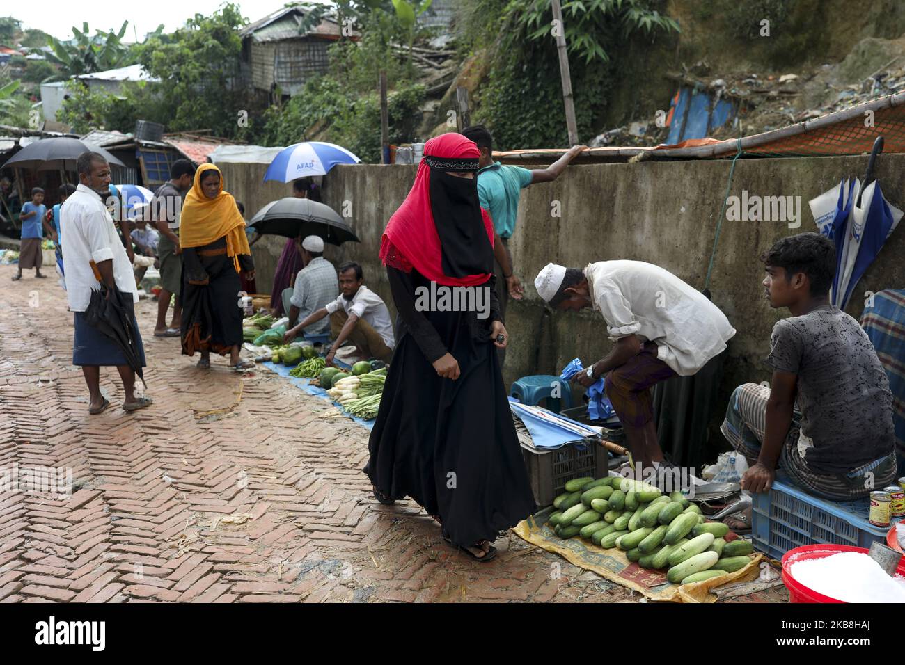 Rohingya people seen on the vegetable market in the Balukhali camp in ...