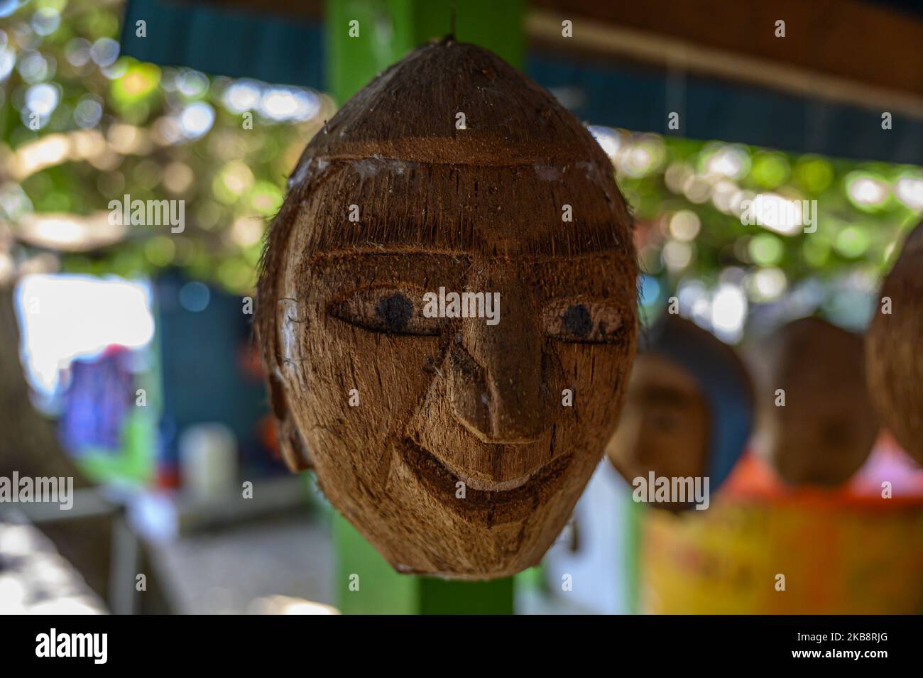 Collections of coconut handicrafts are hung in a stall in Donggala ...
