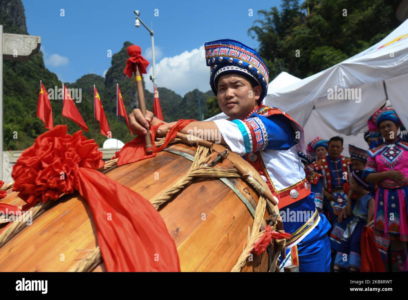 Locals from Zhuang ethnic group dressed in a traditional Zhuang dress ...