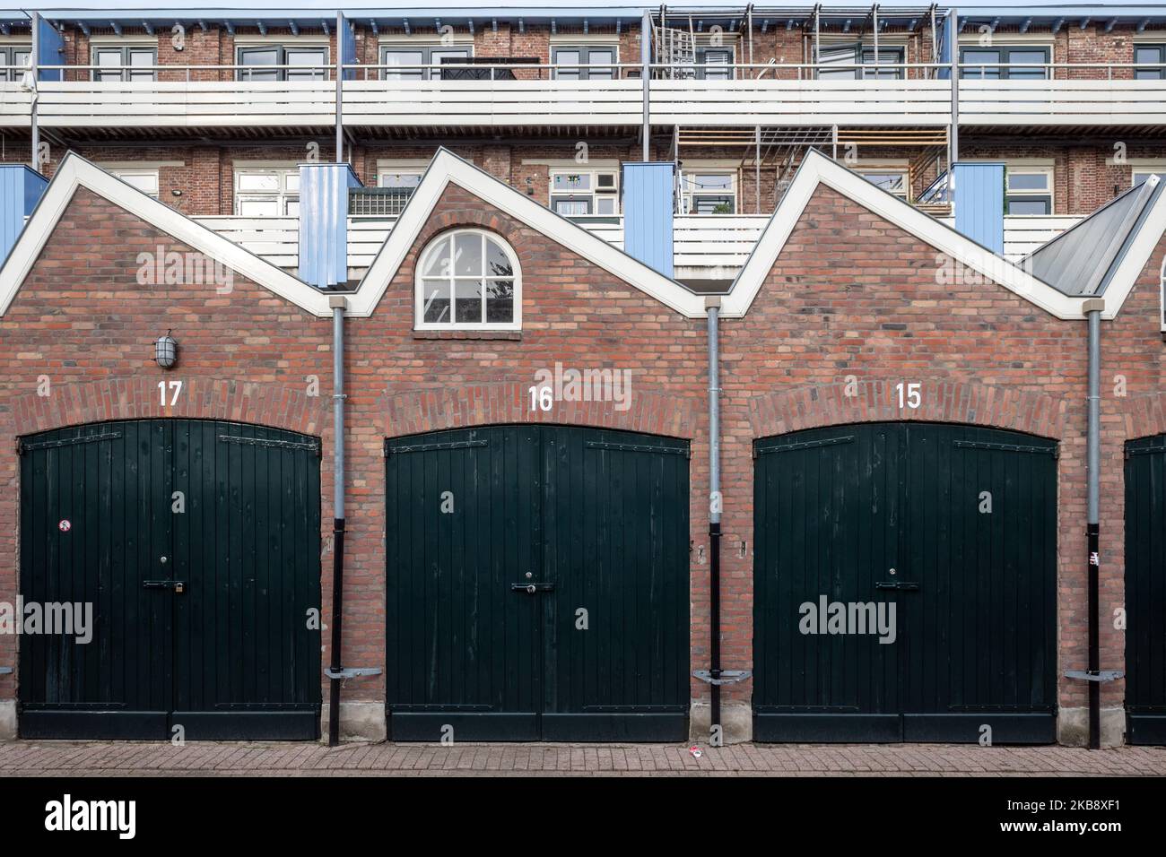 Outdoor street view in front of exterior garage entrance with wooden ...