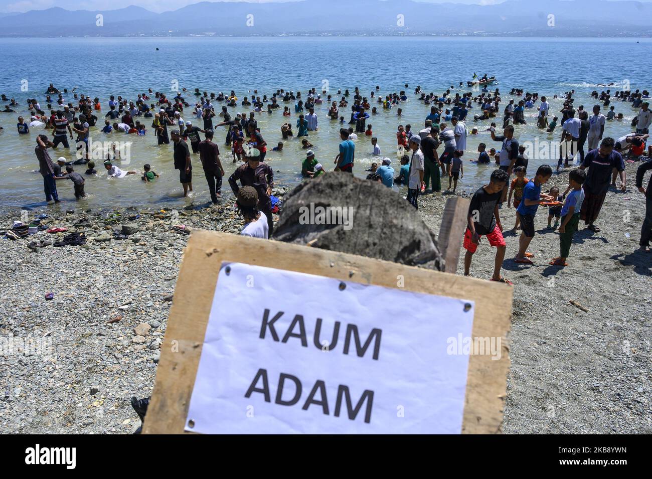 Residents throw themselves into the sea during the Safar bathing ritual ...