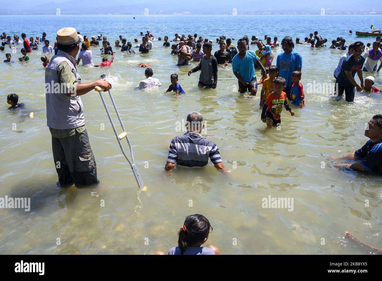 Residents throw themselves into the sea during the Safar bathing ritual ...
