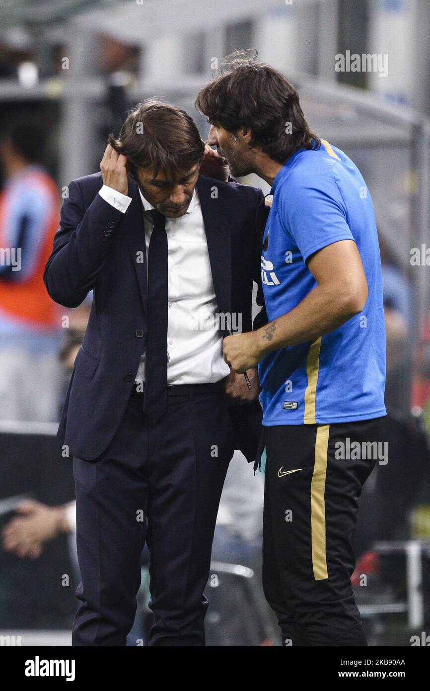 Inter coach Antonio Conte talks with Inter assistant coach Cristian ...