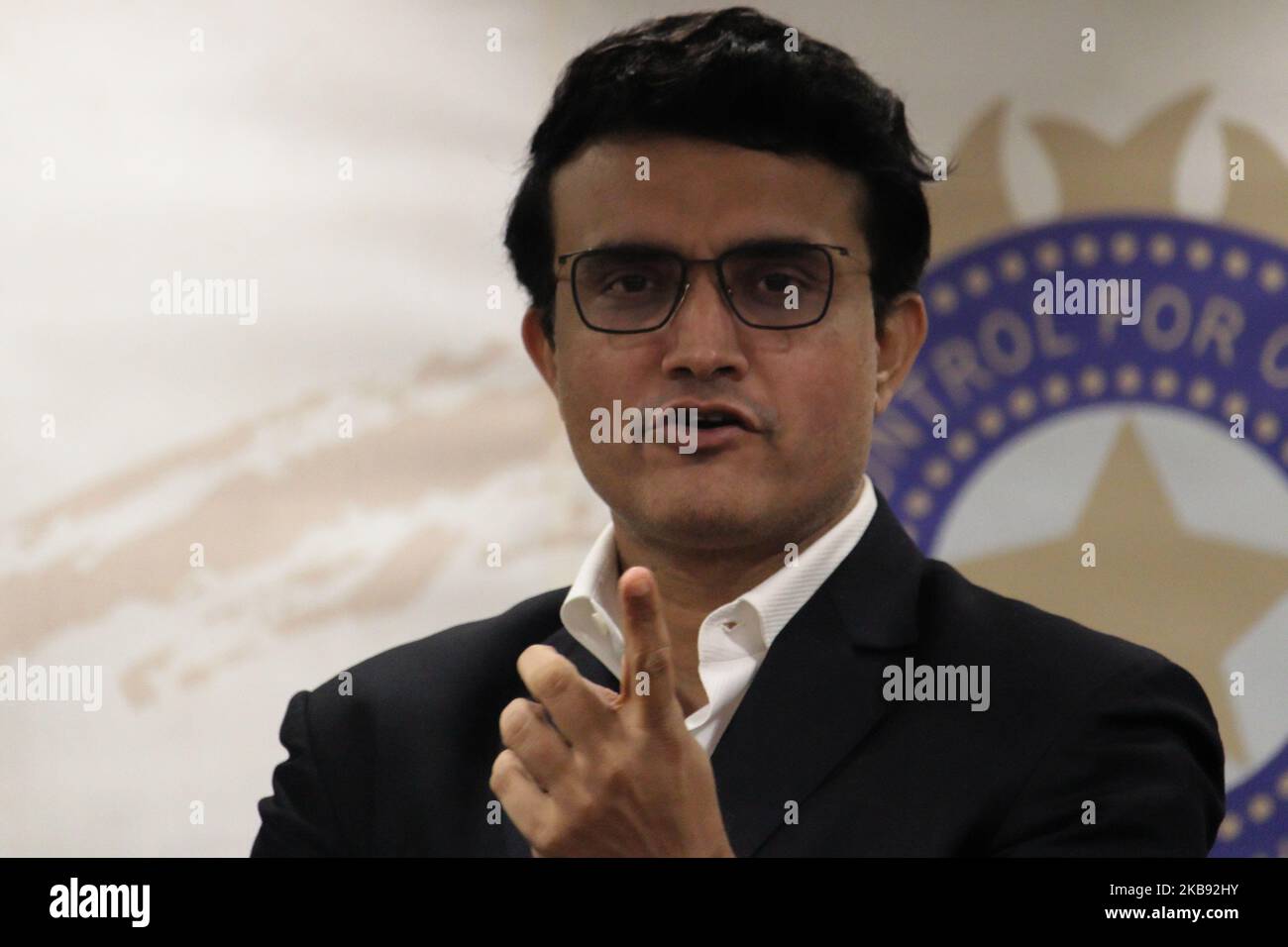 Former Indian cricketer Sourav Ganguly reacts during a press conference at the Board of Control ...