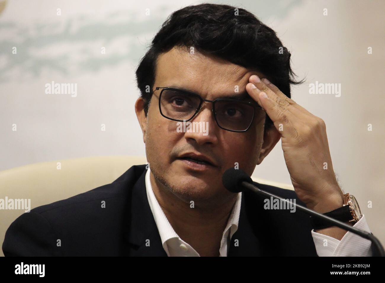 Former Indian cricketer Sourav Ganguly reacts during a press conference at the Board of Control ...