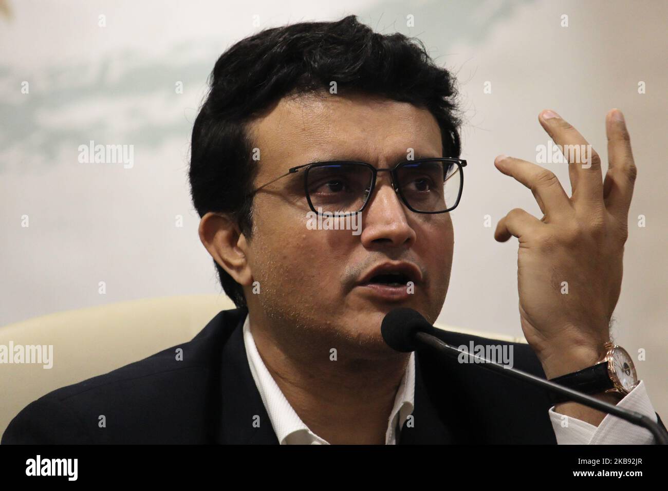 Former Indian cricketer Sourav Ganguly reacts during a press conference at the Board of Control ...
