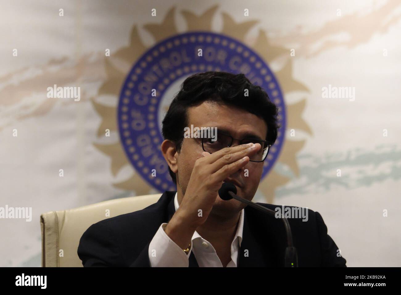 Former Indian cricketer Sourav Ganguly reacts during a press conference at the Board of Control ...