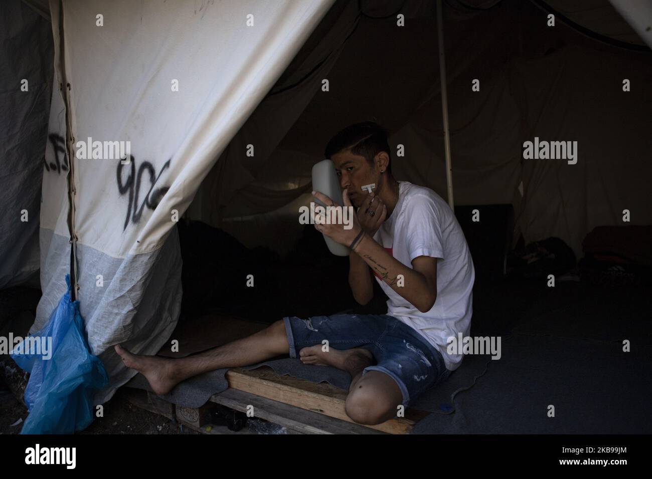 Migrant sit in his tents in Moria Refugee Camp on October 17, 2019 in ...