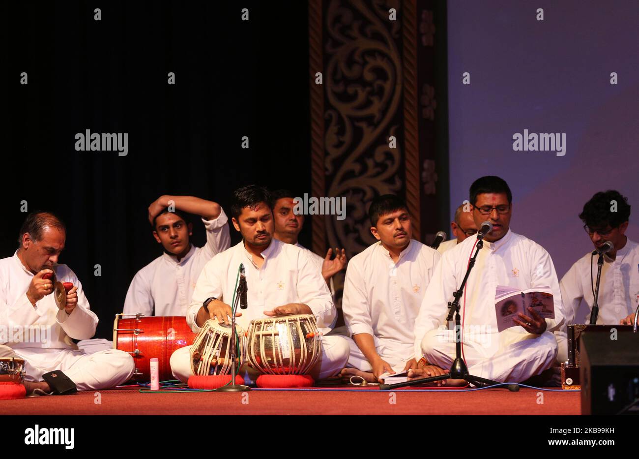 Hindu devotees sing bhajans (devotional songs) at the BAPS Shri ...