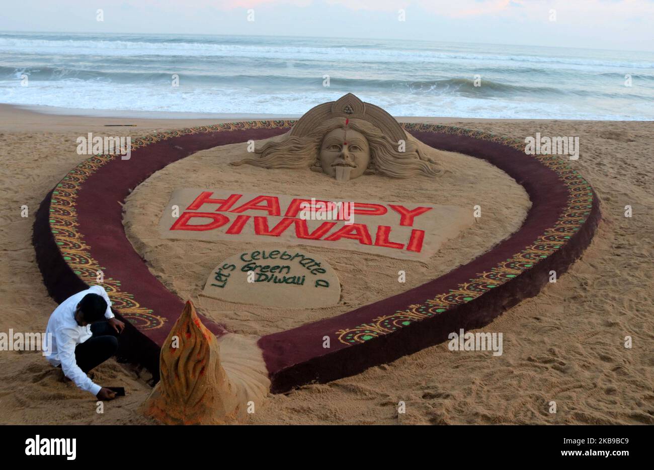 A festival of lights ''Diwali' sand sculpture is seen at the Bay of ...