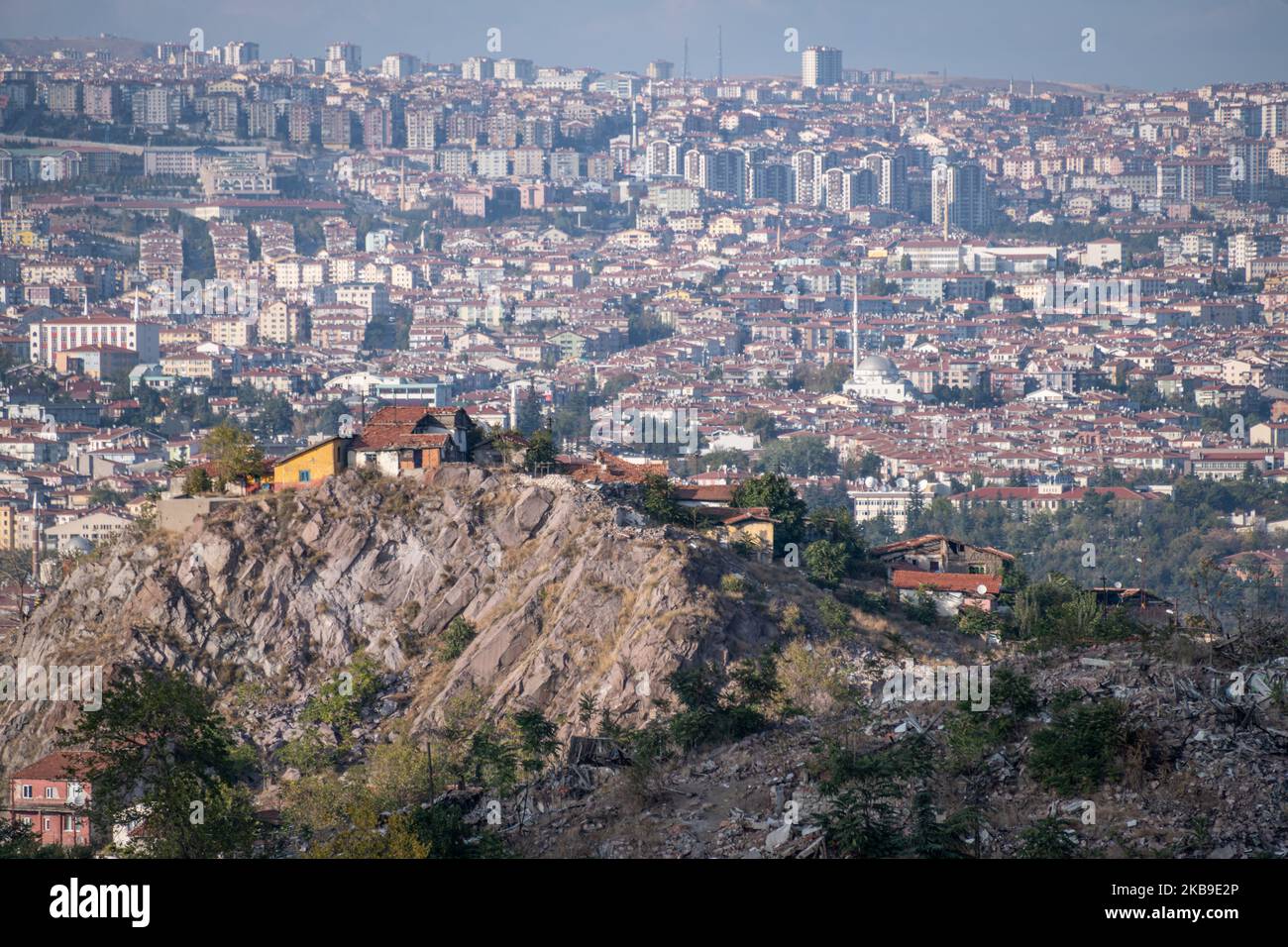 On Oct. 27, 2019, dilapidated slums rise above the modern urban skyline ...