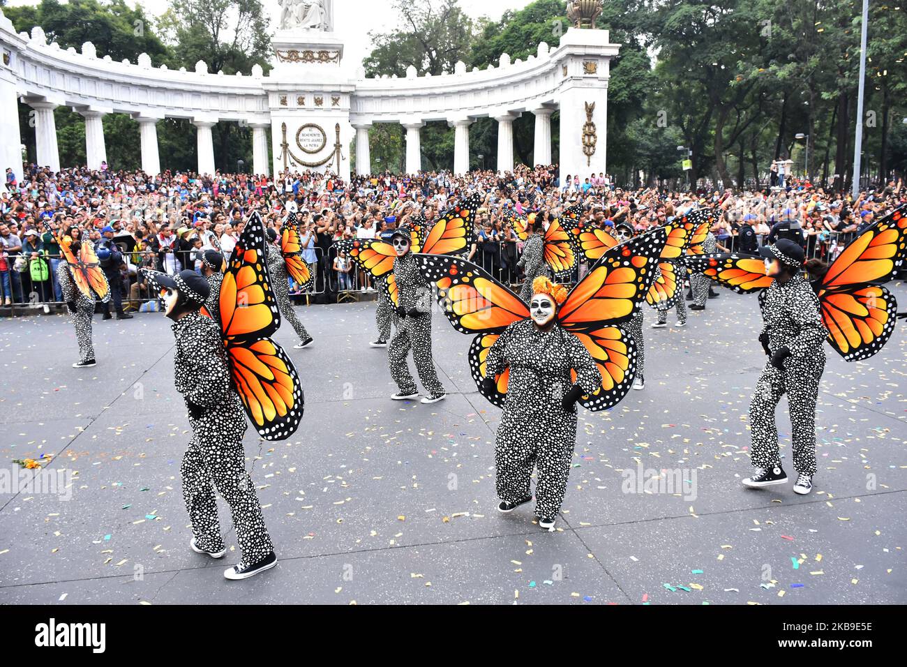 Participants dressed as monarch butterfly take part during the ...