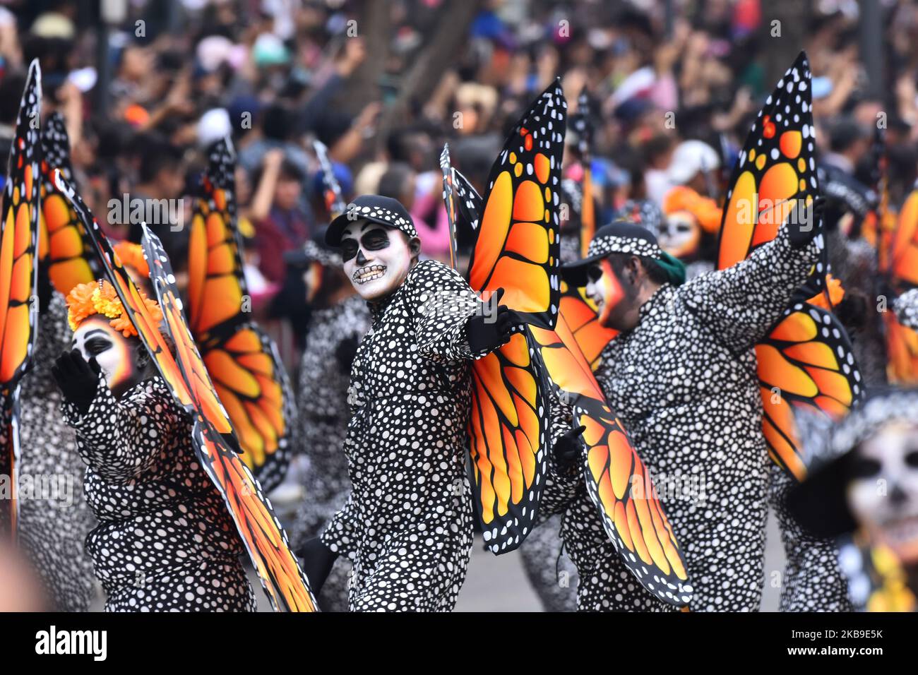 Participants dressed as monarch butterfly take part during the ...