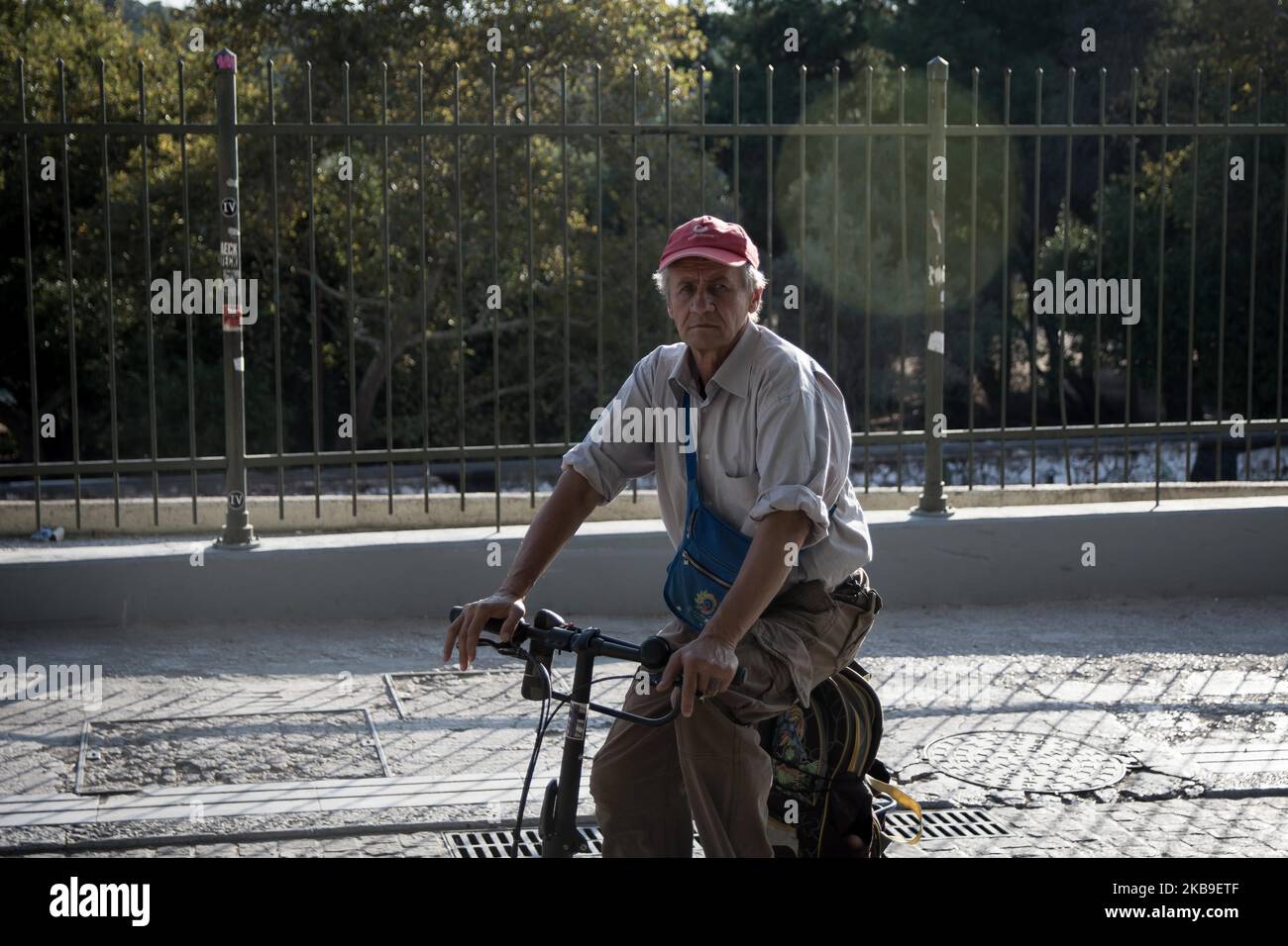 A man rides a bicycle in the center of Athens, Greece on 28 October ...