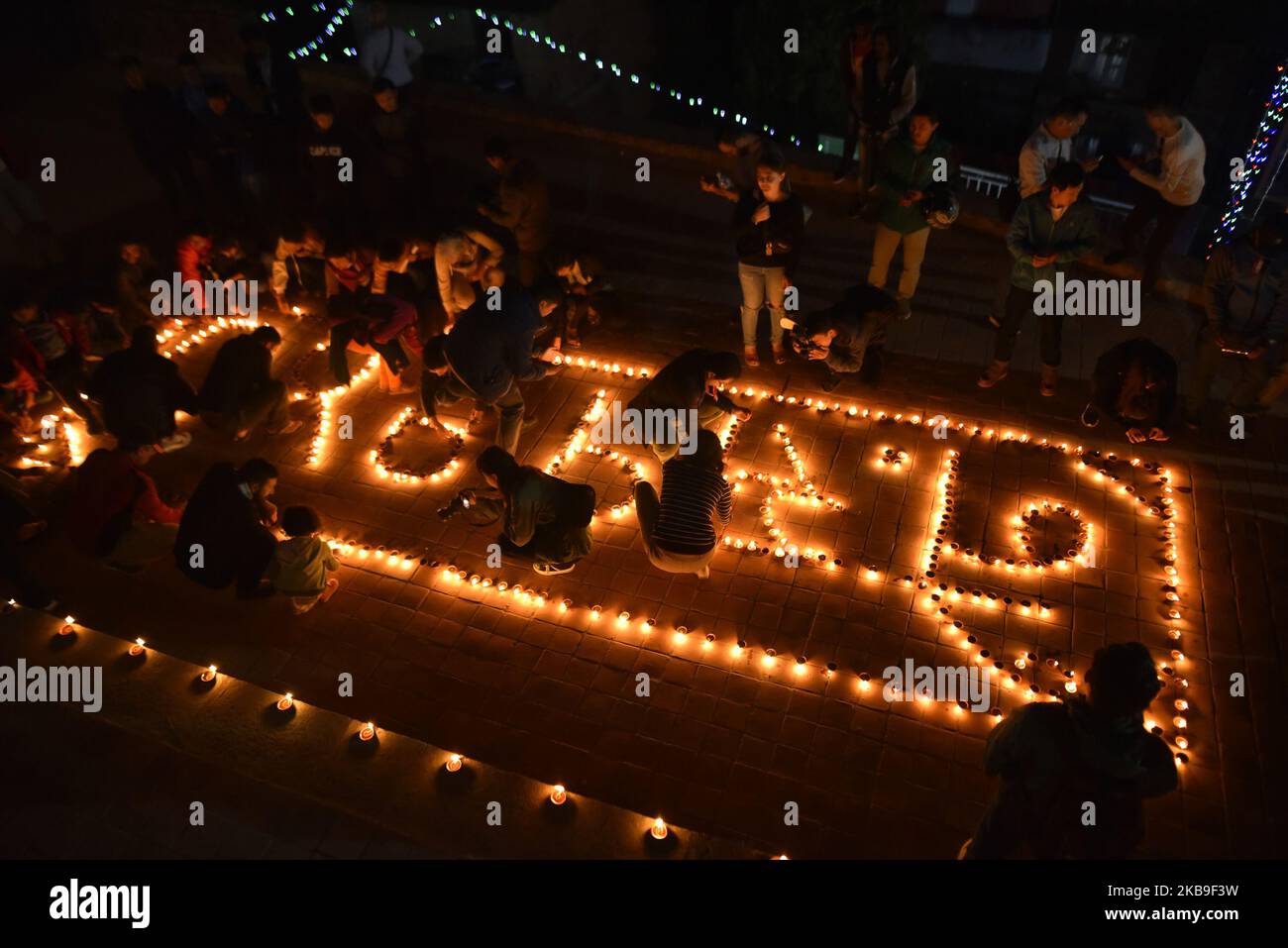 Nepalese people lightening oil lamp during eve of Newari New Year 1140 ...