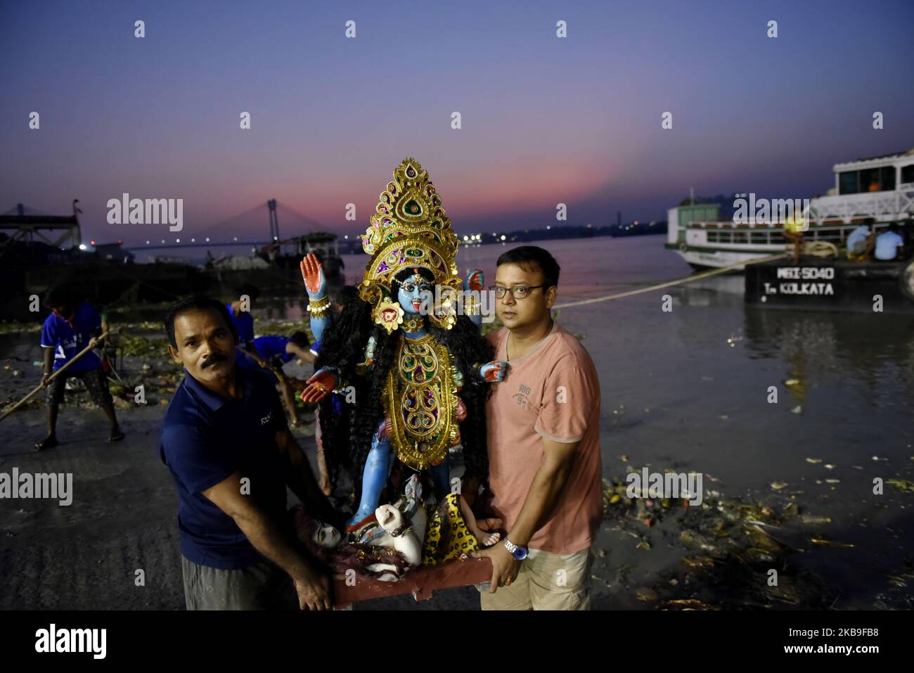 Immersion of goddess Kali on the ghats of the river Ganga (A holy river ...