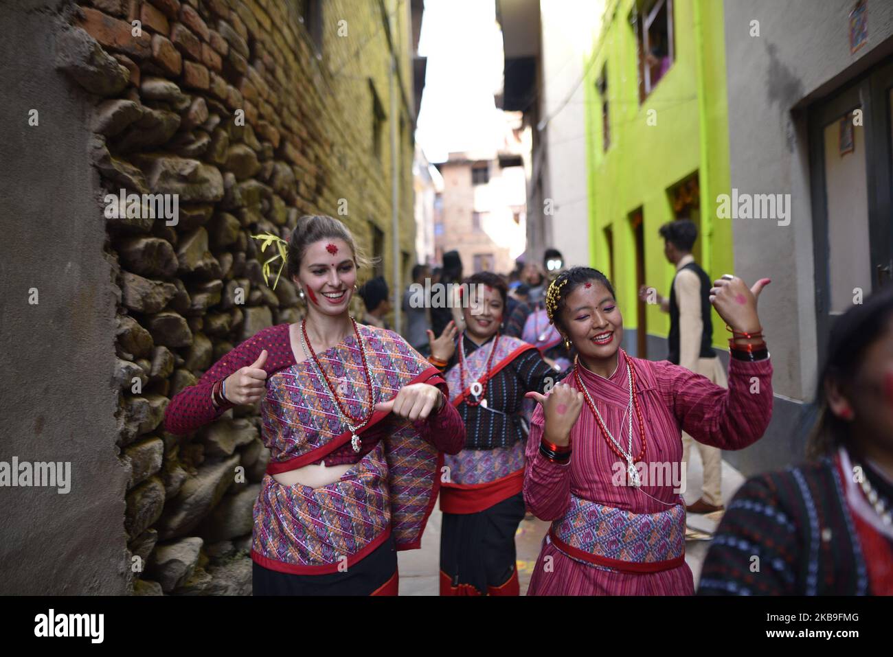 A Tourist in a traditional attire dance in a traditional instruments ...