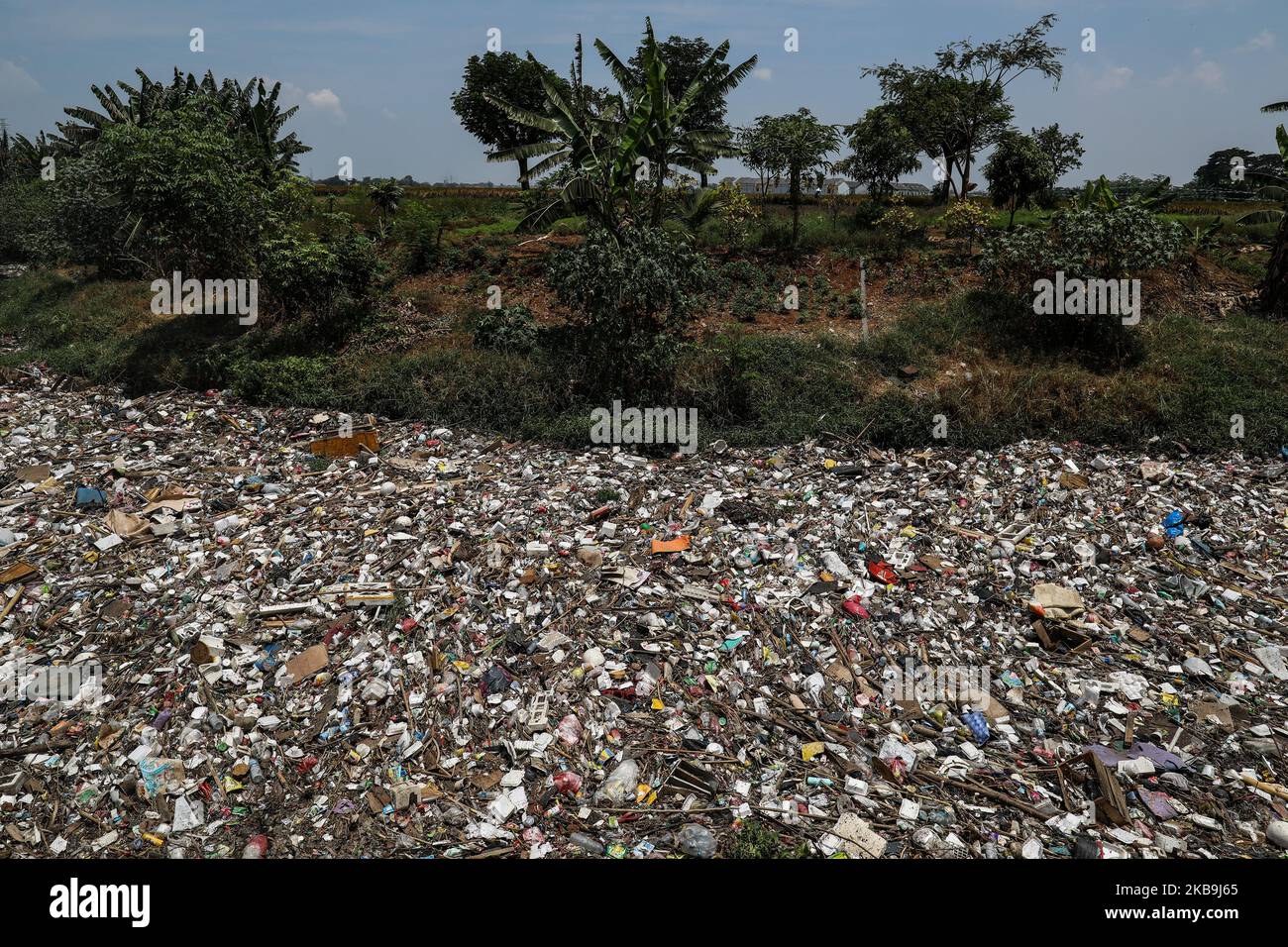 A view of a river covered by garbage in Bekasi, West Java, Indonesia ...