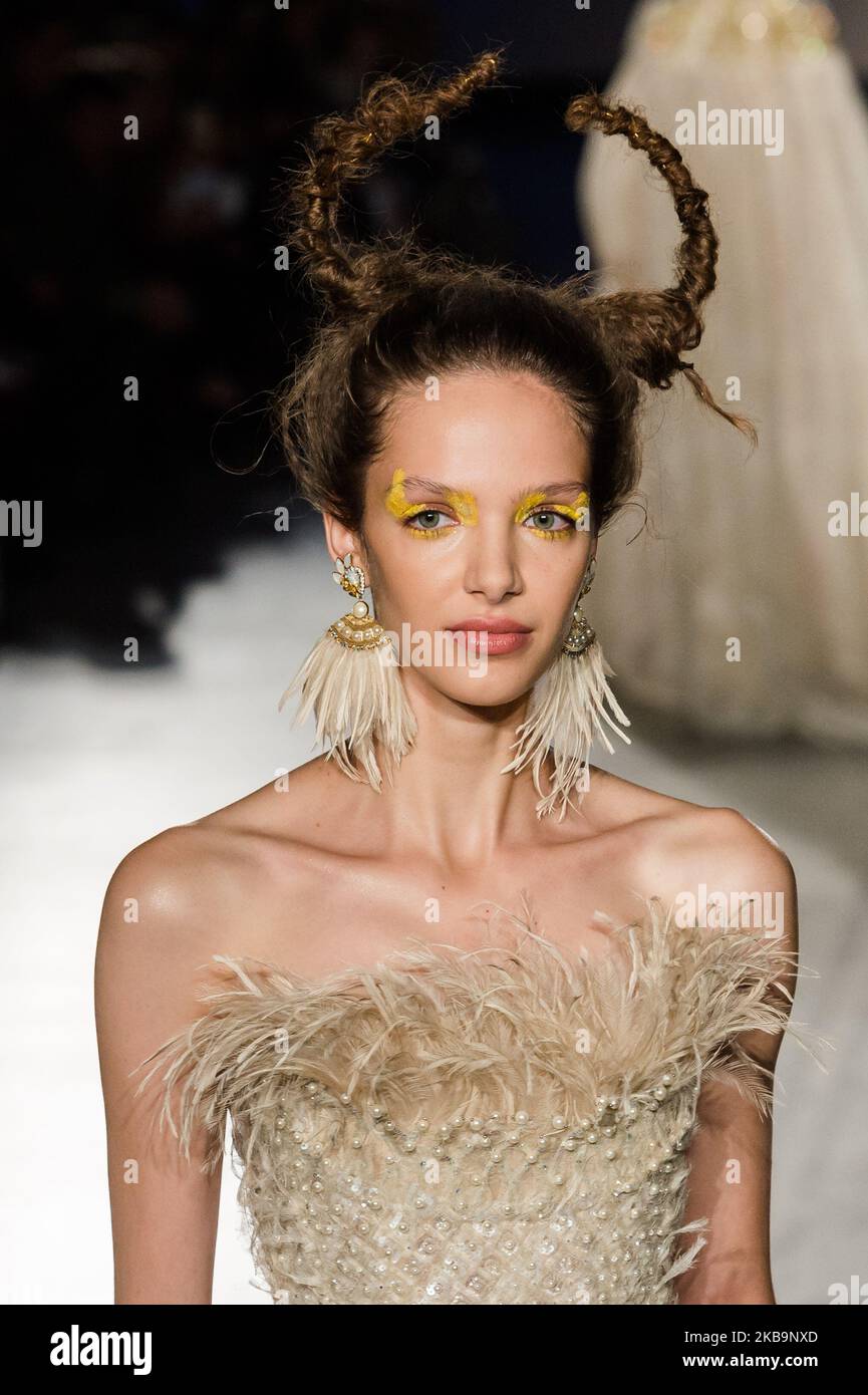 A model walks the runway during Guo Pei's first ever runway show in the ...