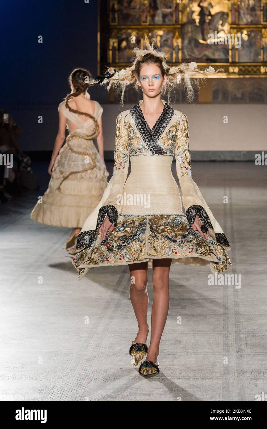 A model walks the runway during Guo Pei's first ever runway show in the ...