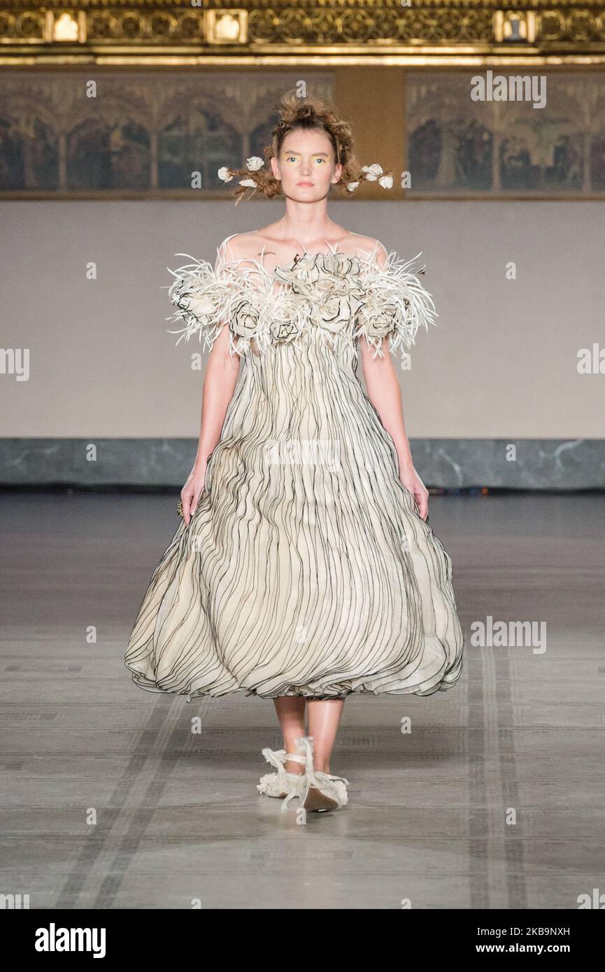 A model walks the runway during Guo Pei's first ever runway show in the ...