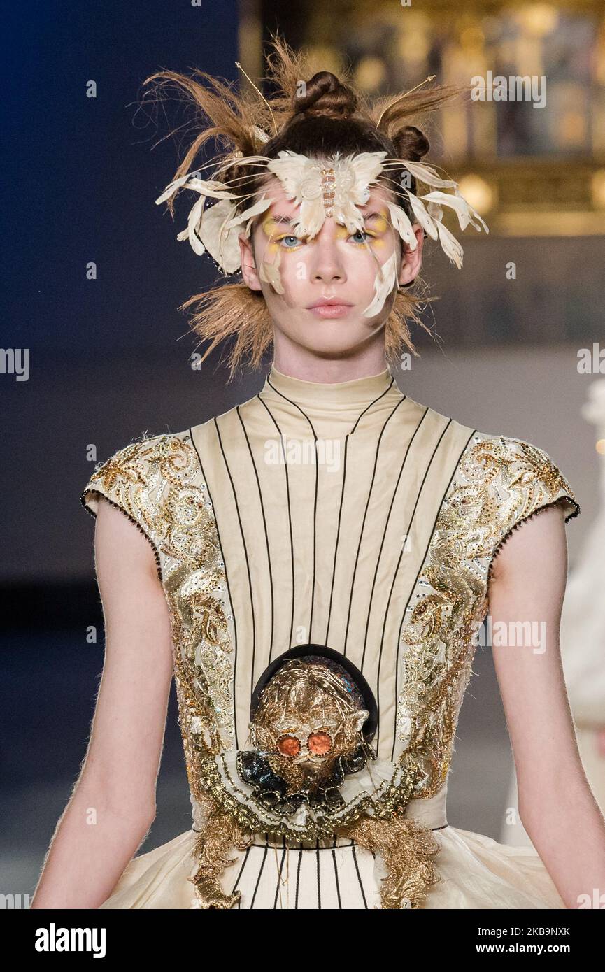 A model walks the runway during Guo Pei's first ever runway show in the ...