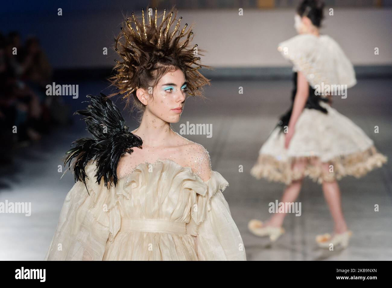 Models walk the runway during Guo Pei's first ever runway show in the ...