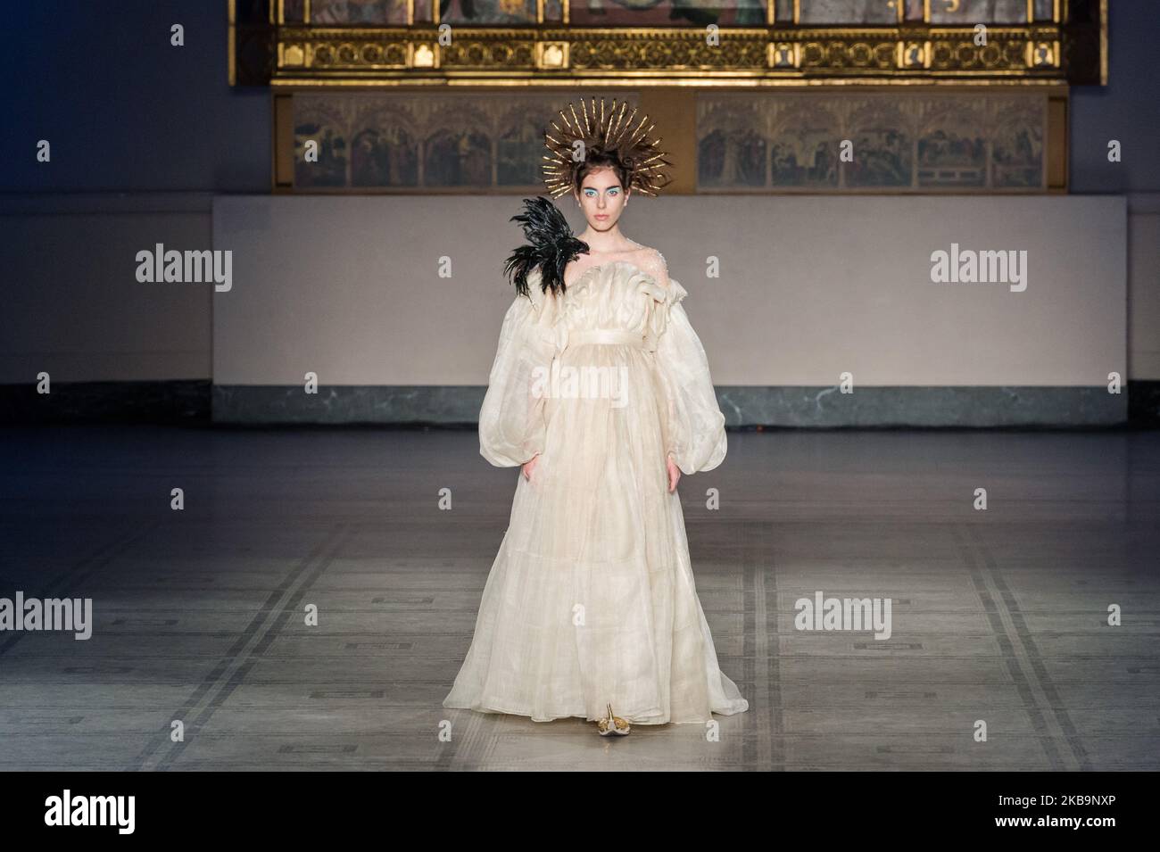 A model walks the runway during Guo Pei's first ever runway show in the ...