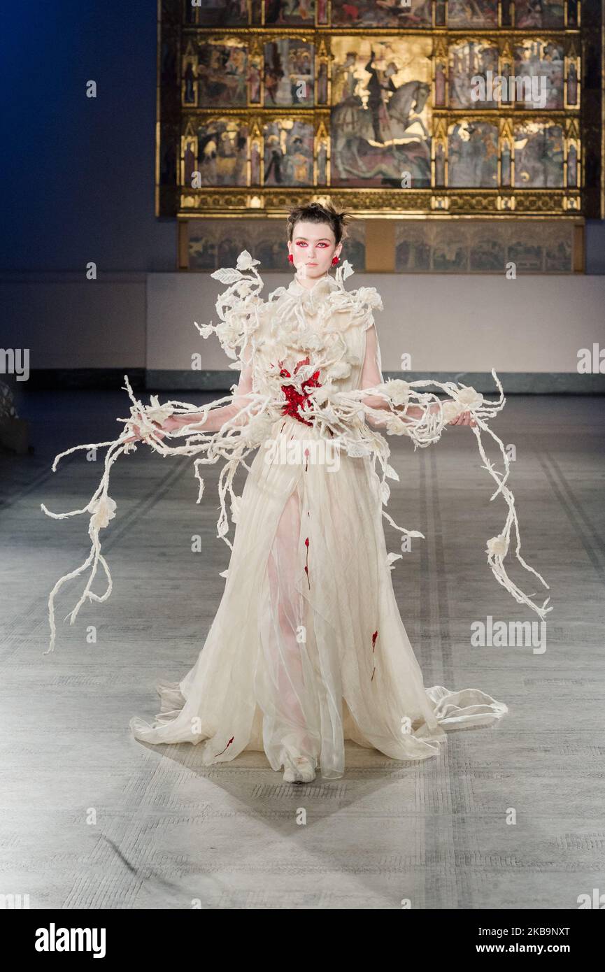 A model walks the runway during Guo Pei's first ever runway show in the ...