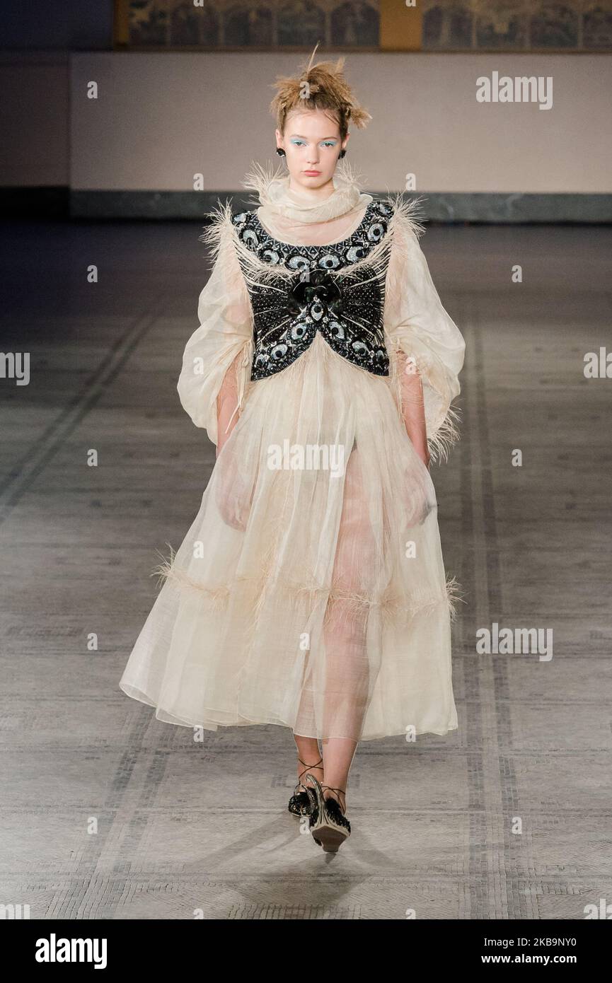 A model walks the runway during Guo Pei's first ever runway show in the ...