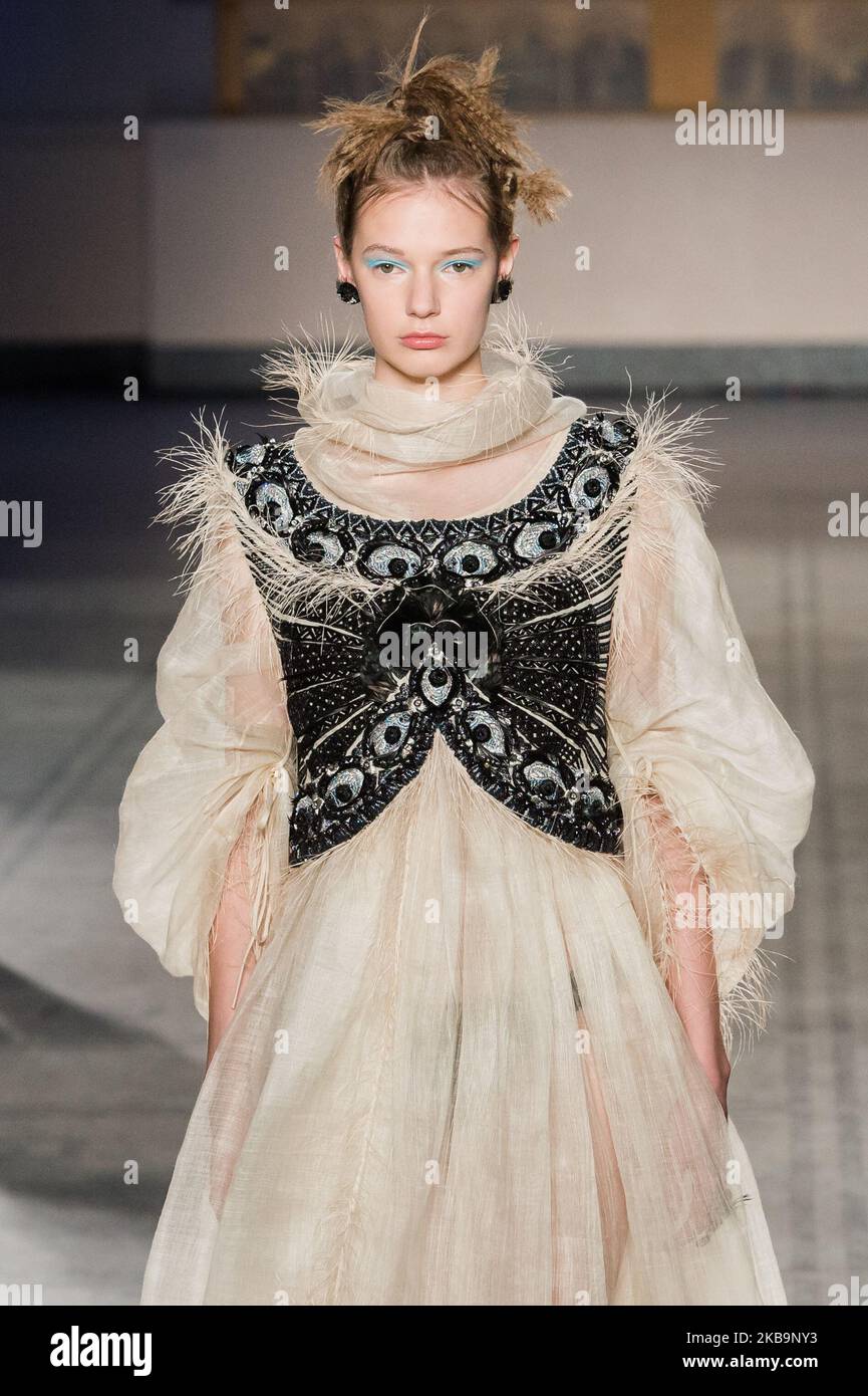 A model walks the runway during Guo Pei's first ever runway show in the ...