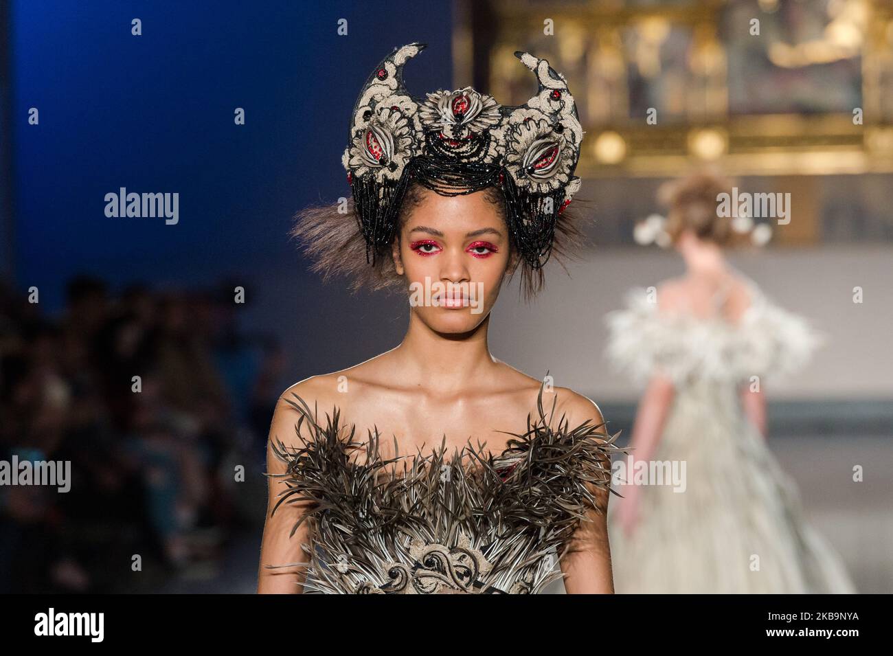 A model walks the runway during Guo Pei's first ever runway show in the ...