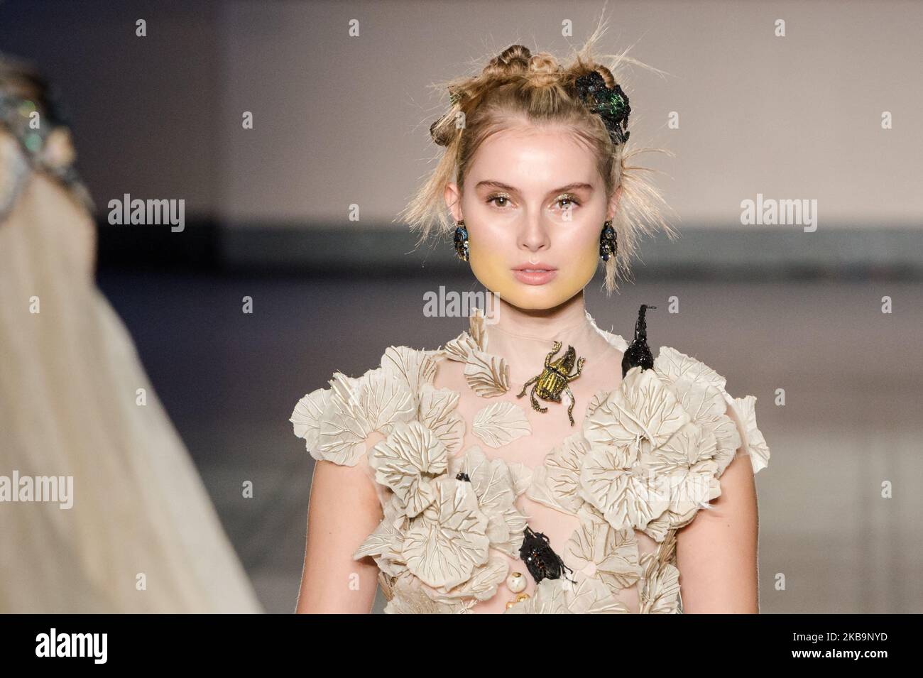 A model walks the runway during Guo Pei's first ever runway show in the ...
