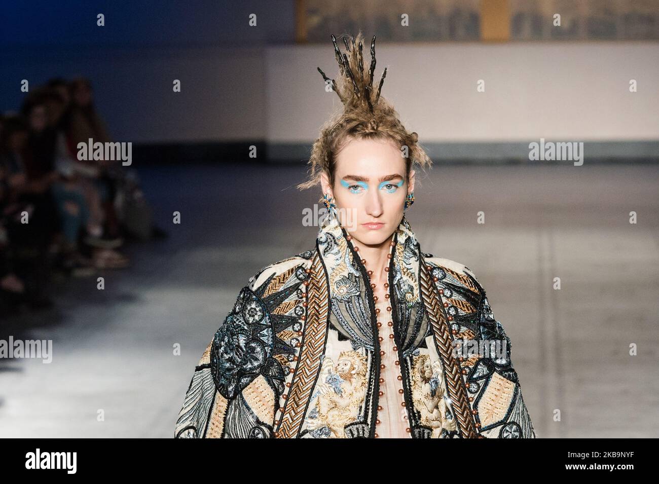 A model walks the runway during Guo Pei's first ever runway show in the ...