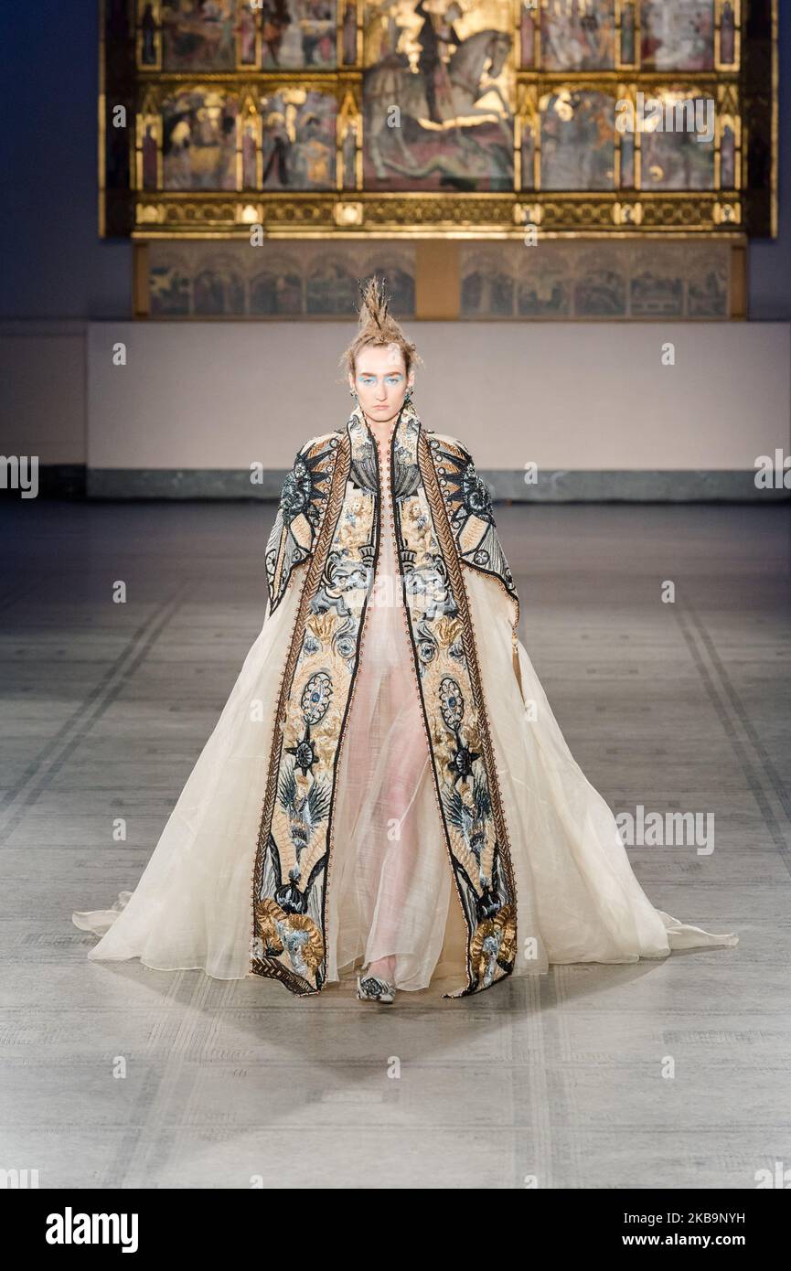 A model walks the runway during Guo Pei's first ever runway show in the ...