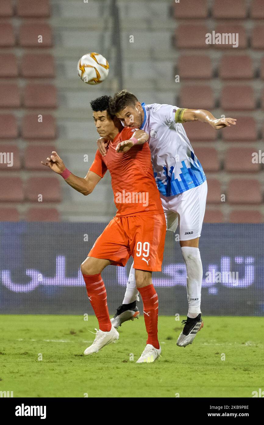 Al Arabi's Hamdi Harbaoui contests a header during the QNB Stars League ...
