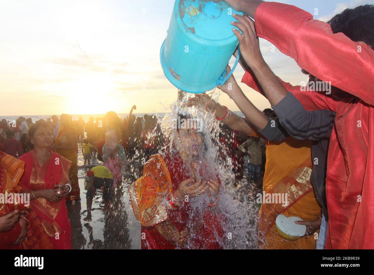 Devotees perform Chhath Puja rituals on the coast of the Arabian Sea in ...