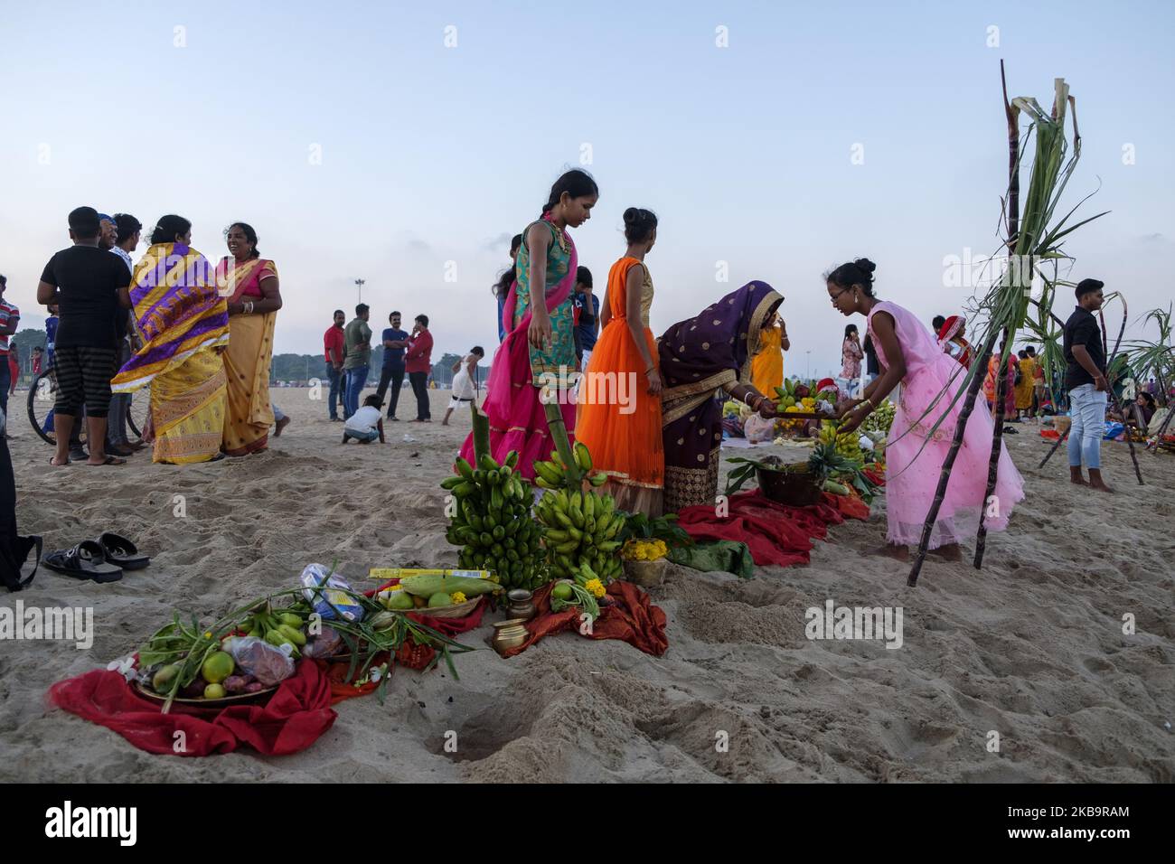 A family is getting ready to do the rituals of Chhath puja at Marina ...