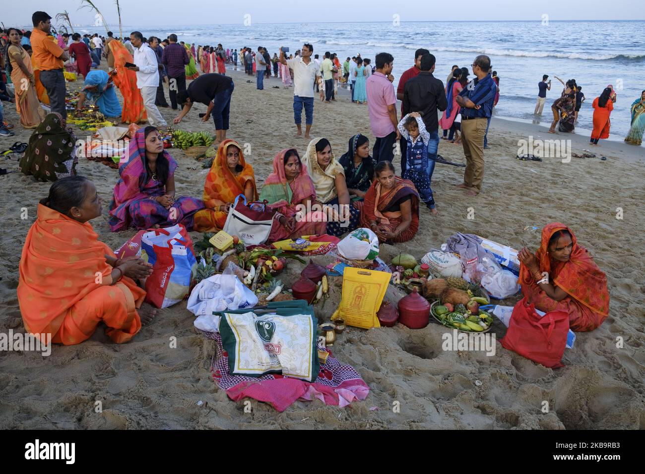 A family is getting ready to do the rituals of Chhath puja at Marina ...