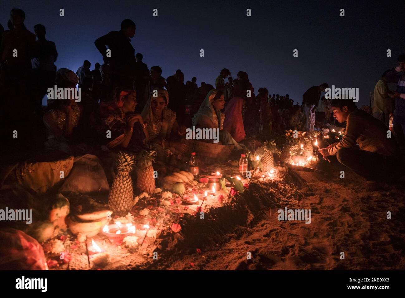 People are arranging for the early morning rituals of Chhath Puja at ...