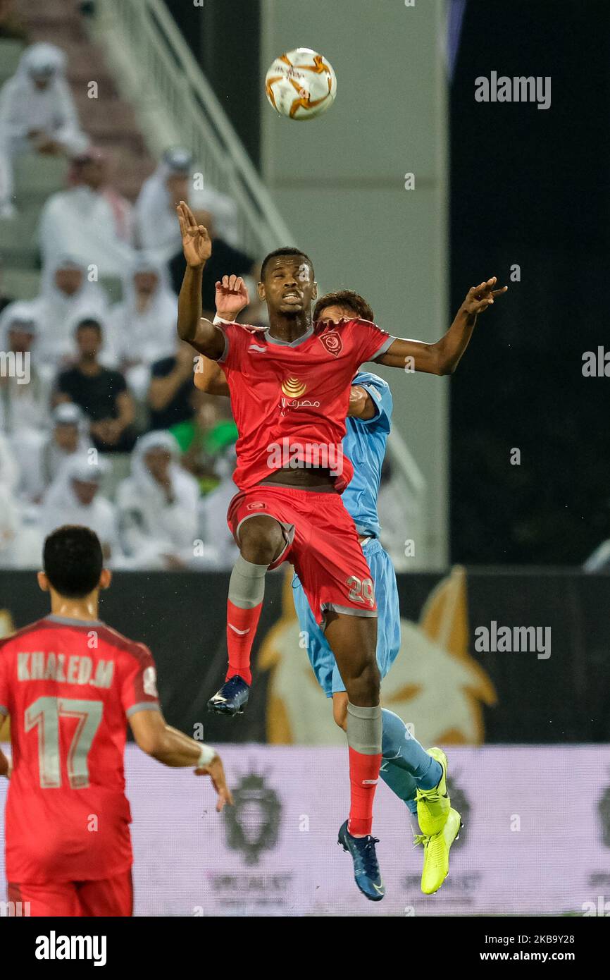 Al Duhail's Mohammed Muntari wins a header at the Abdullah bin Khalifa ...
