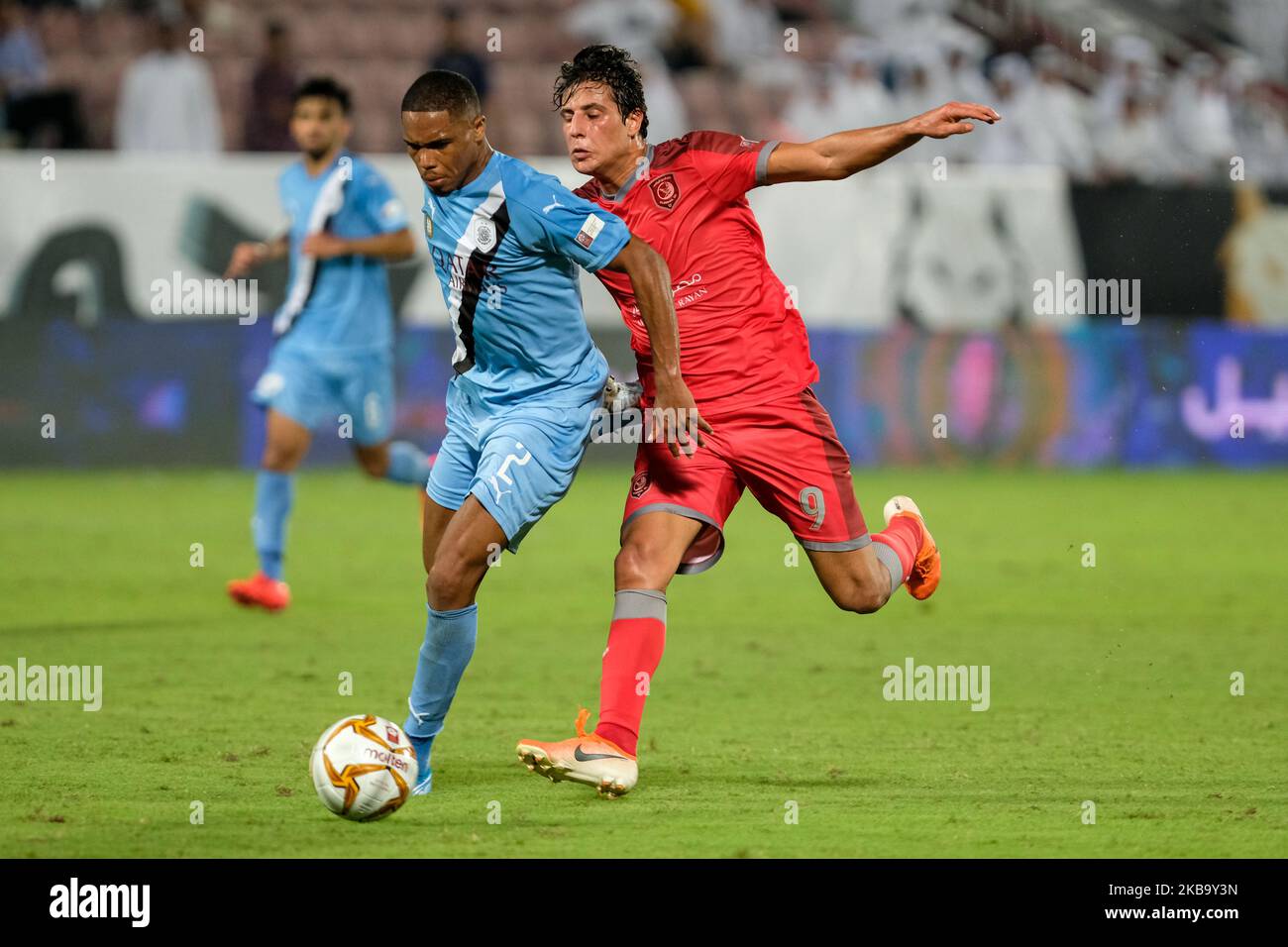 Al Duhail's Mohanad Ali and Al Sadd's Ró-Ró fight for the ball in the ...