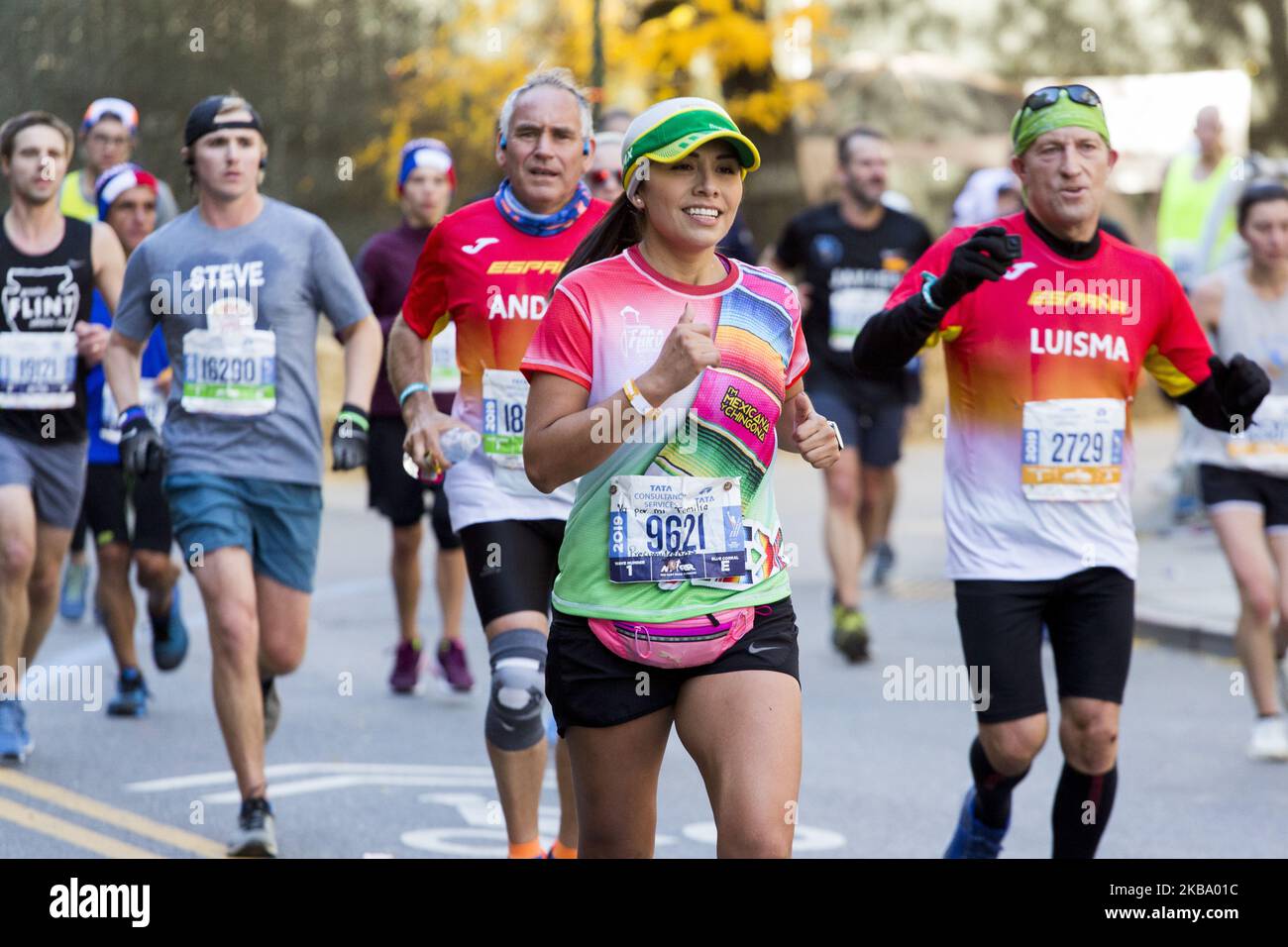 A runner smiles while competing in the New York City Marathon Sunday ...