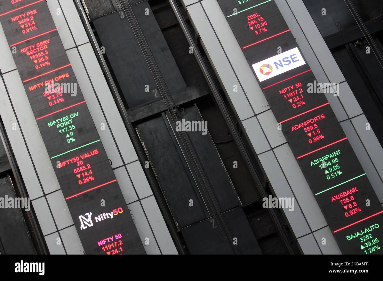A logo of the National Stock Exchange (NSE) is seen on electronic ...