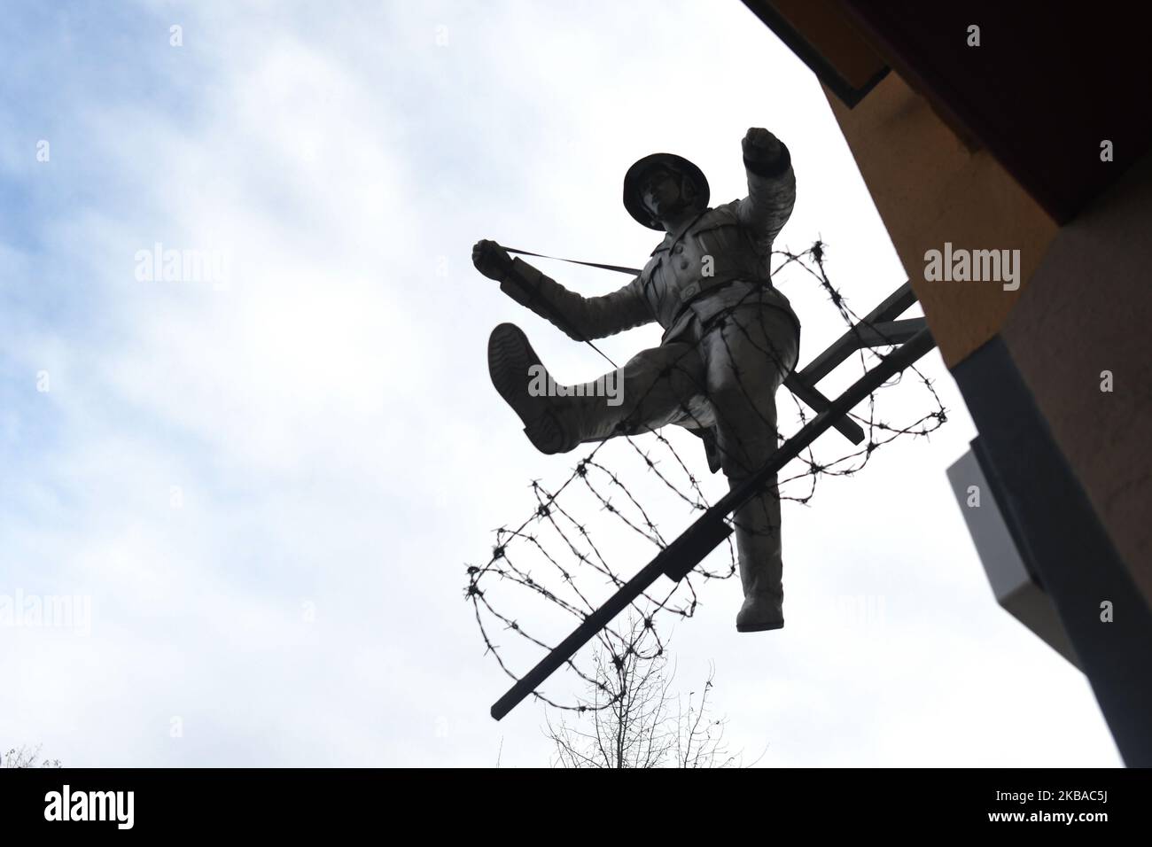 A statue to Hans Konrad Schumann, an East German border guard who ...