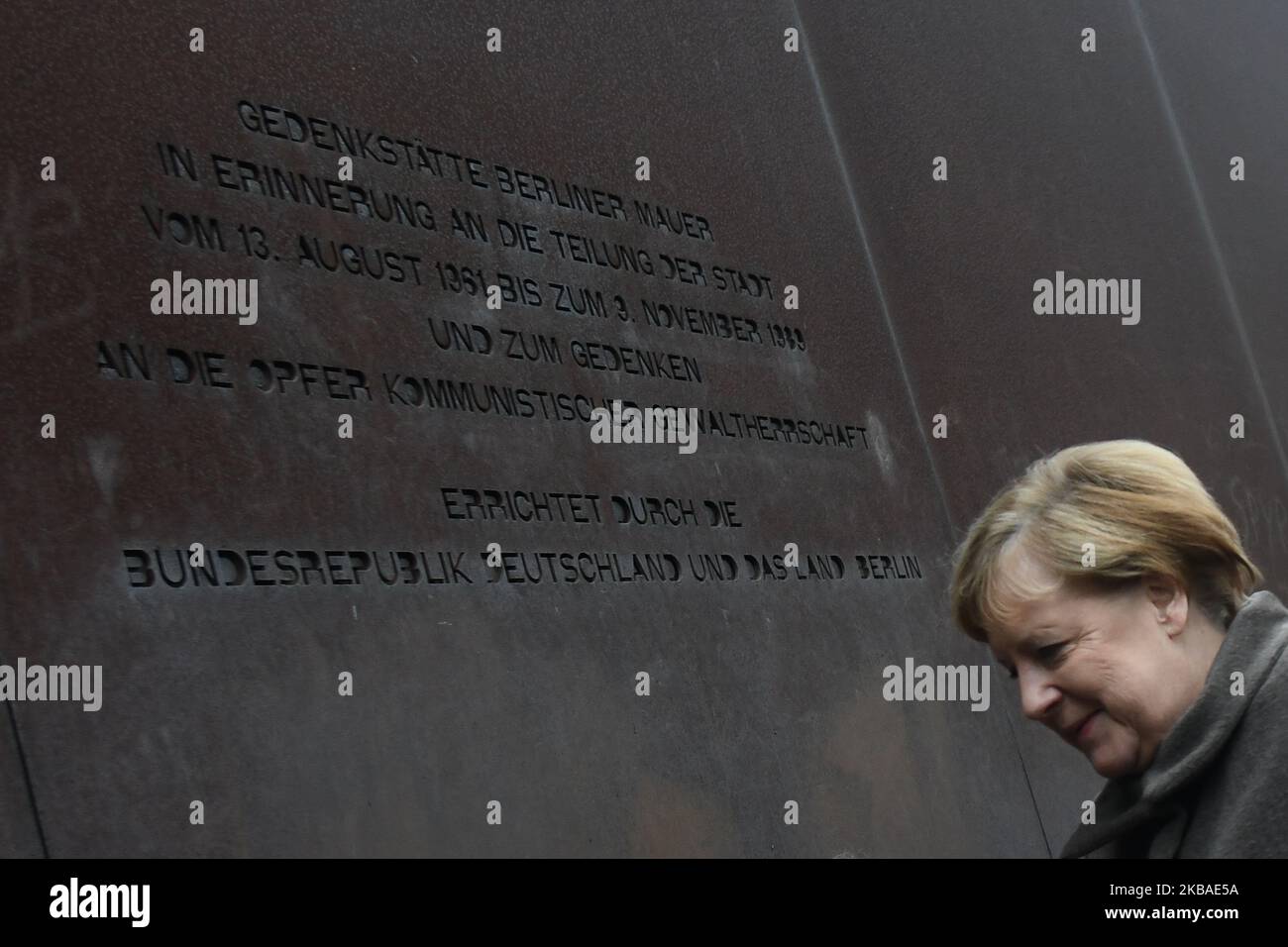 German Chancellor Angela Merkel at a memorial to the Berlin Wall at ...