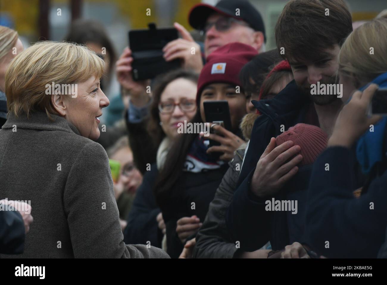 Angela Merkel, Germany's Chancellor, meets members of the public ...