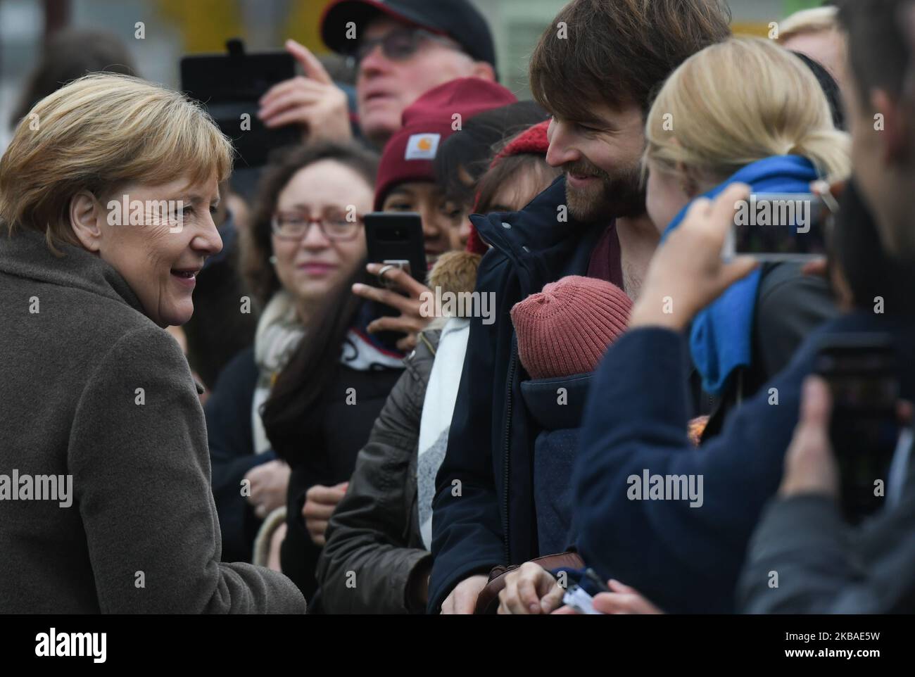 Angela Merkel, Germany's Chancellor, meets members of the public ...