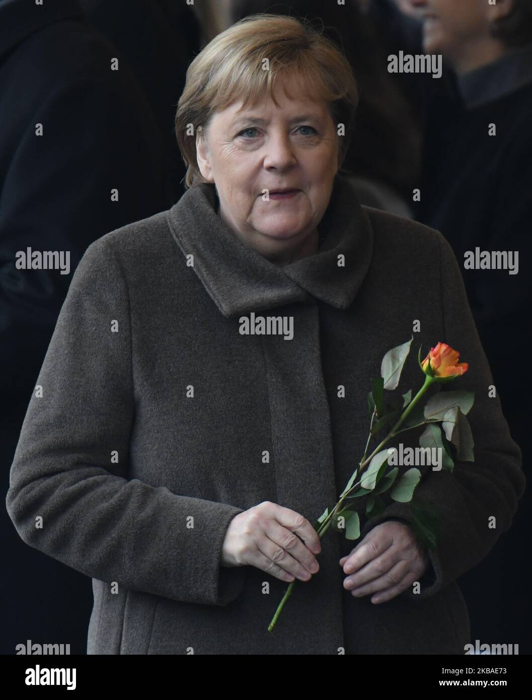 Angela Merkel, Chancellor of Germany, arrives with a rose in her hand ...